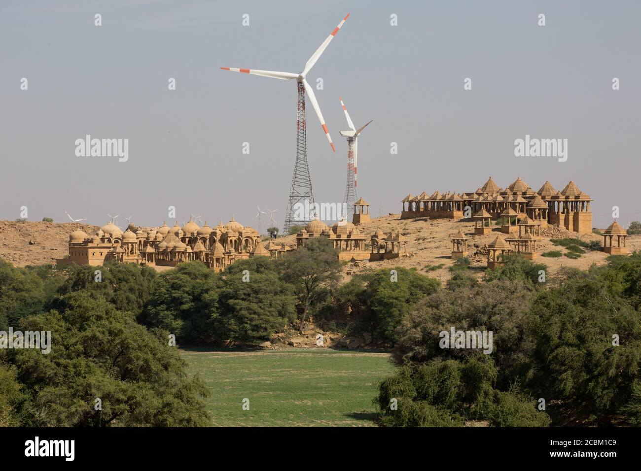 Wind turbines and Bada Bagh on hill, Jaisalmer, Rajasthan, India Stock ...