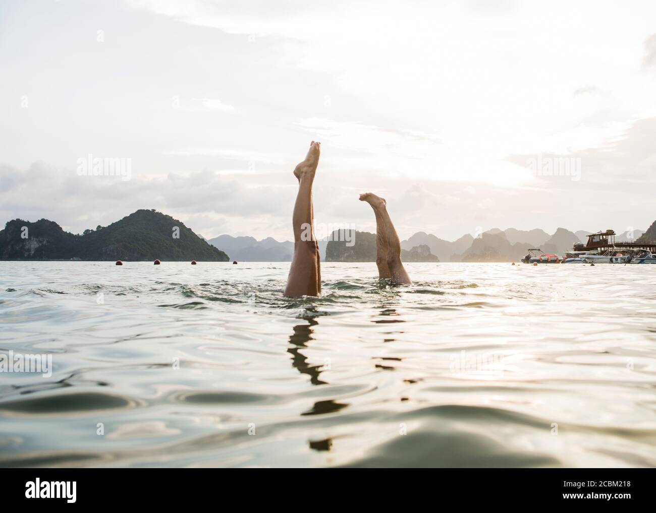 Doing handstand in sea hi-res stock photography and images - Alamy