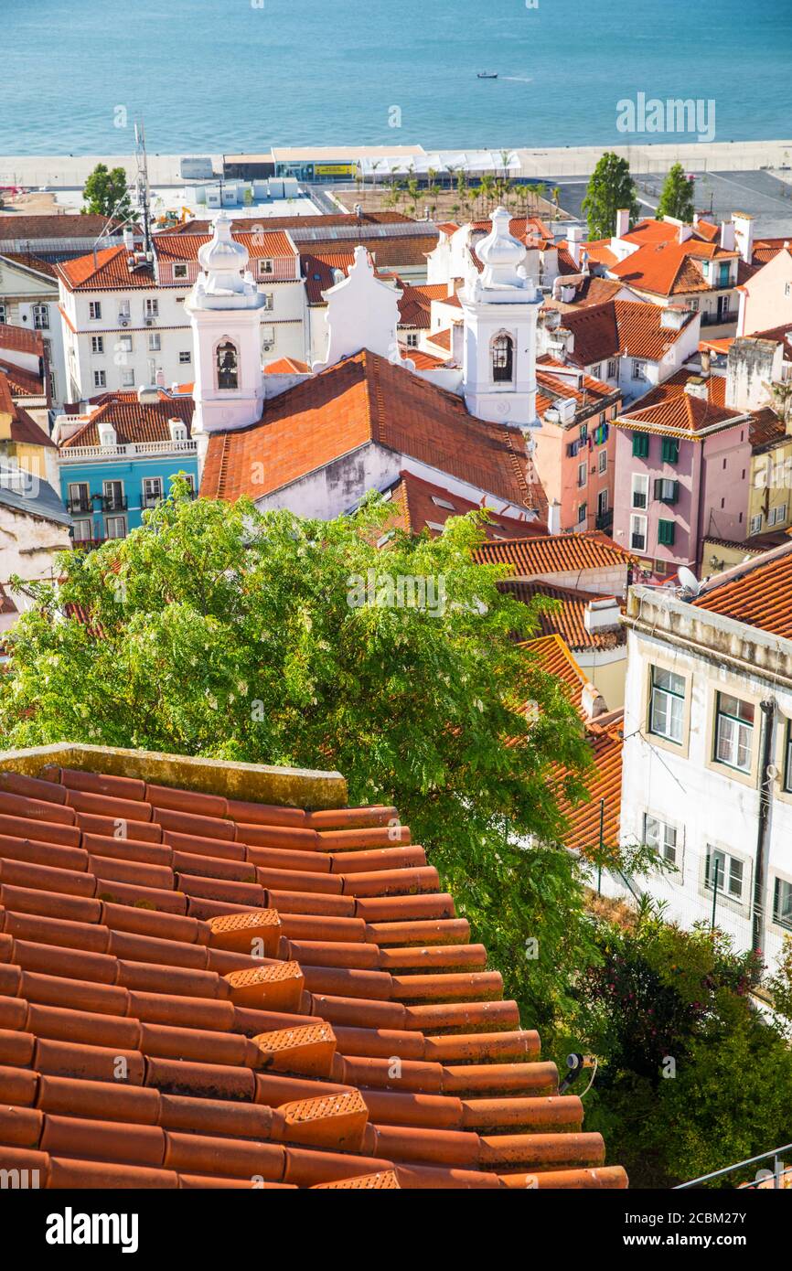 View of sea over rooftops, Lisbon, Portugal Stock Photo - Alamy