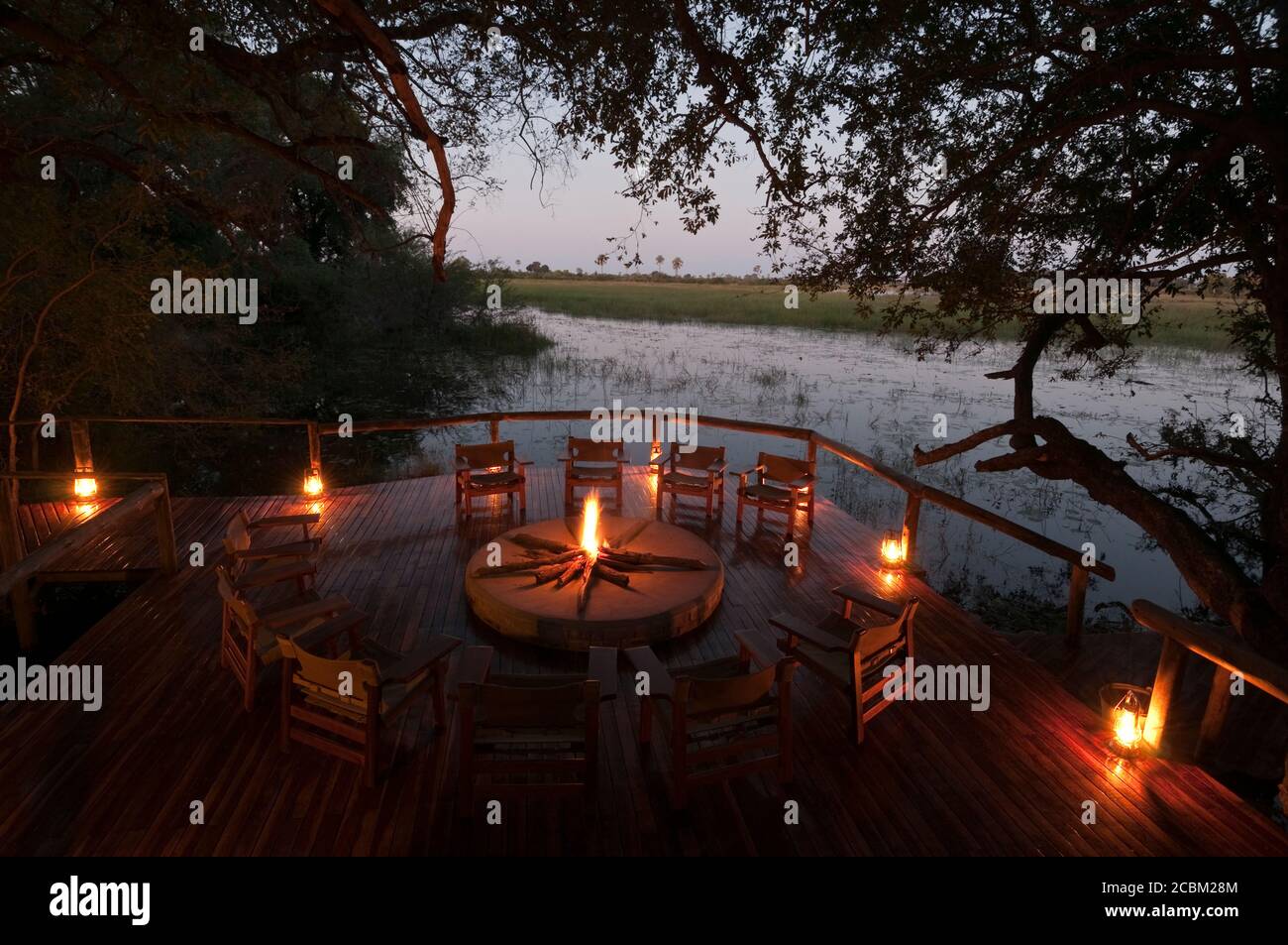 Seating arranged on decking, Abu Camp, Okavango Delta, Botswana Stock ...
