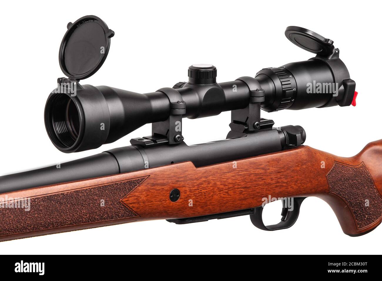 A sniper rifle with a telescopic sight. A carbine with a wooden stock ...