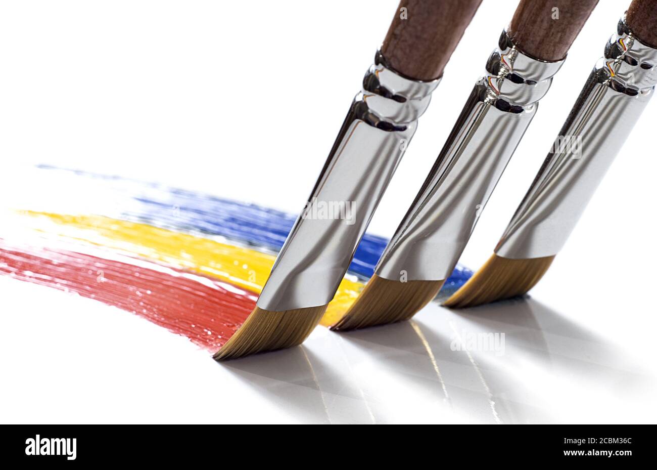 Teamwork concept, three brushes painting rainbow colors Stock Photo - Alamy