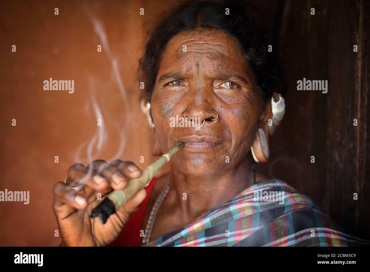 Sora tribal woman in a rural village near Gunupur in Odisha, India ...