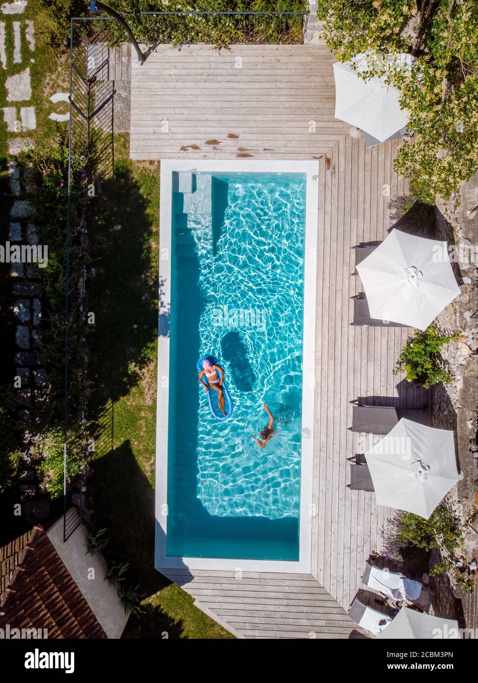 two person swim in the pool at the hotel. View from above, couple men ...