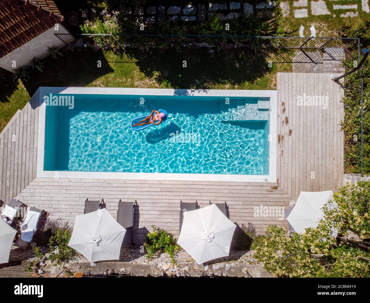 two person swim in the pool at the hotel. View from above, couple men ...