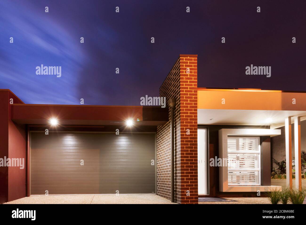 Front view of a modern house with garage Stock Photo - Alamy