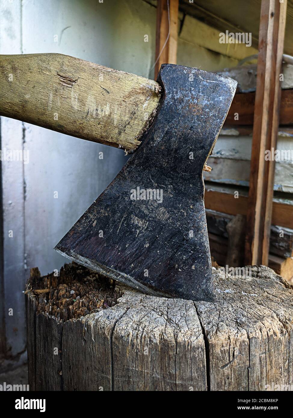 an old textured ax cut into a wide wooden deck Stock Photo - Alamy