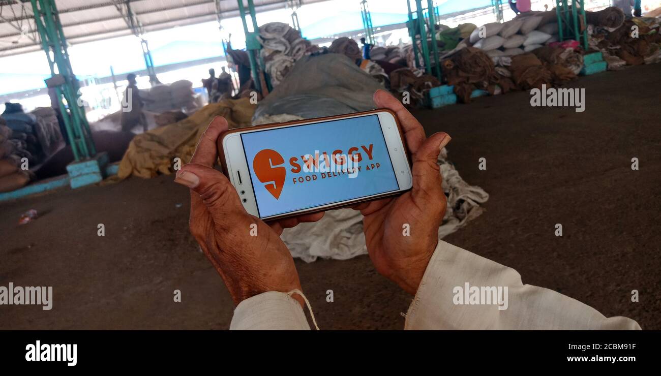 Swiggy food delivery boy hi-res stock photography and images - Alamy