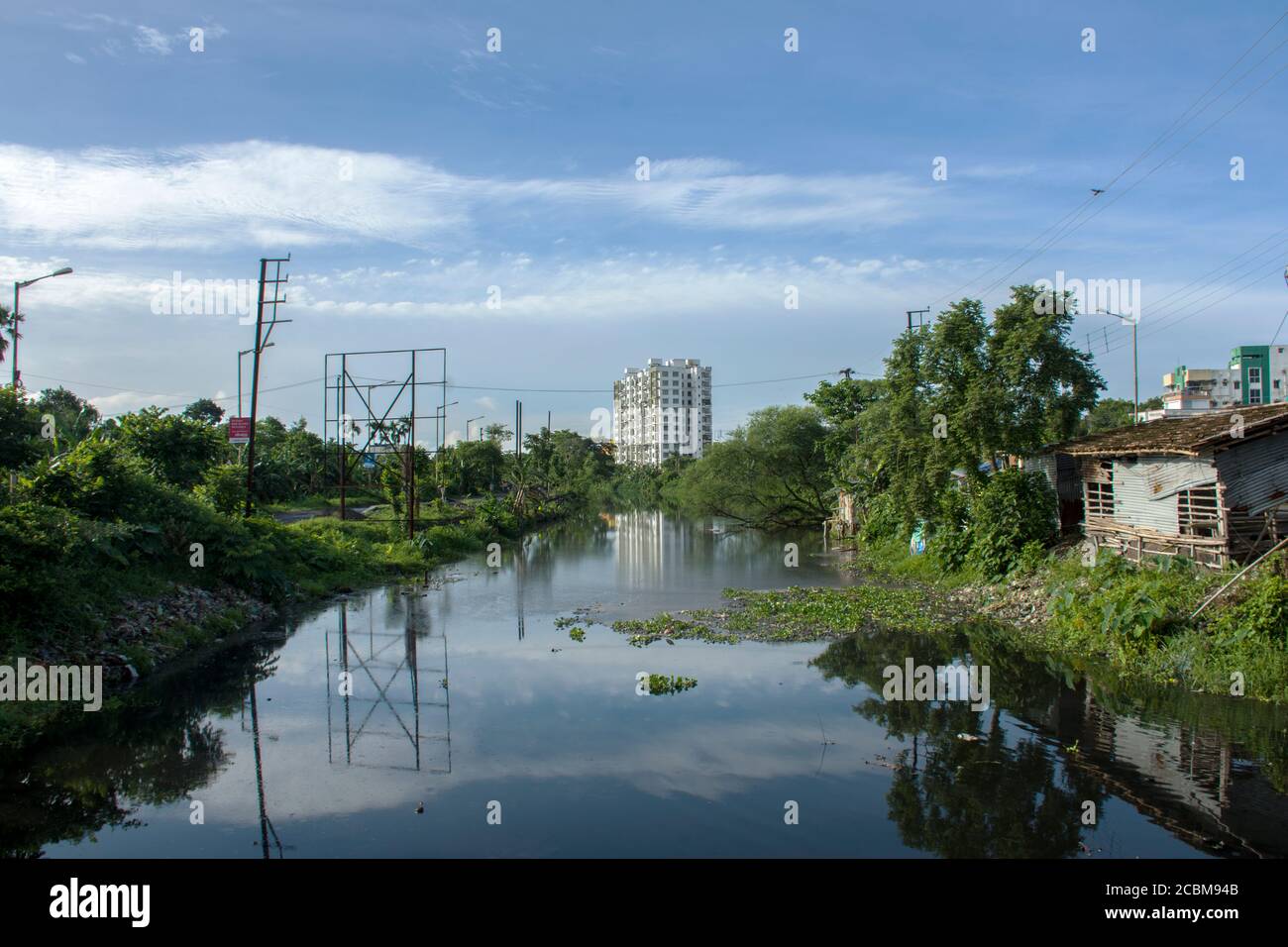 Effect of pollution highrise building beside a small canal full of ...