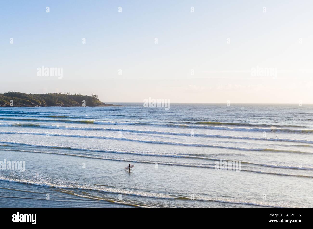 Surfer Entering The Ocean In Tofino British Columbia Canada Stock Photo ...