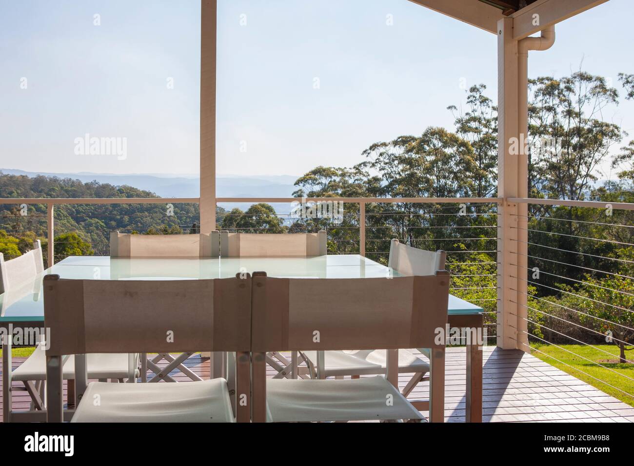 Open air dining area with chairs and table Stock Photo - Alamy