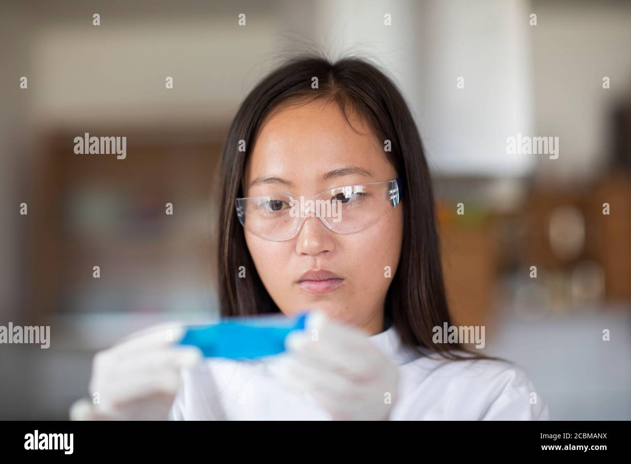 scientist female with lab glasses and tubes in a lab Stock Photo - Alamy