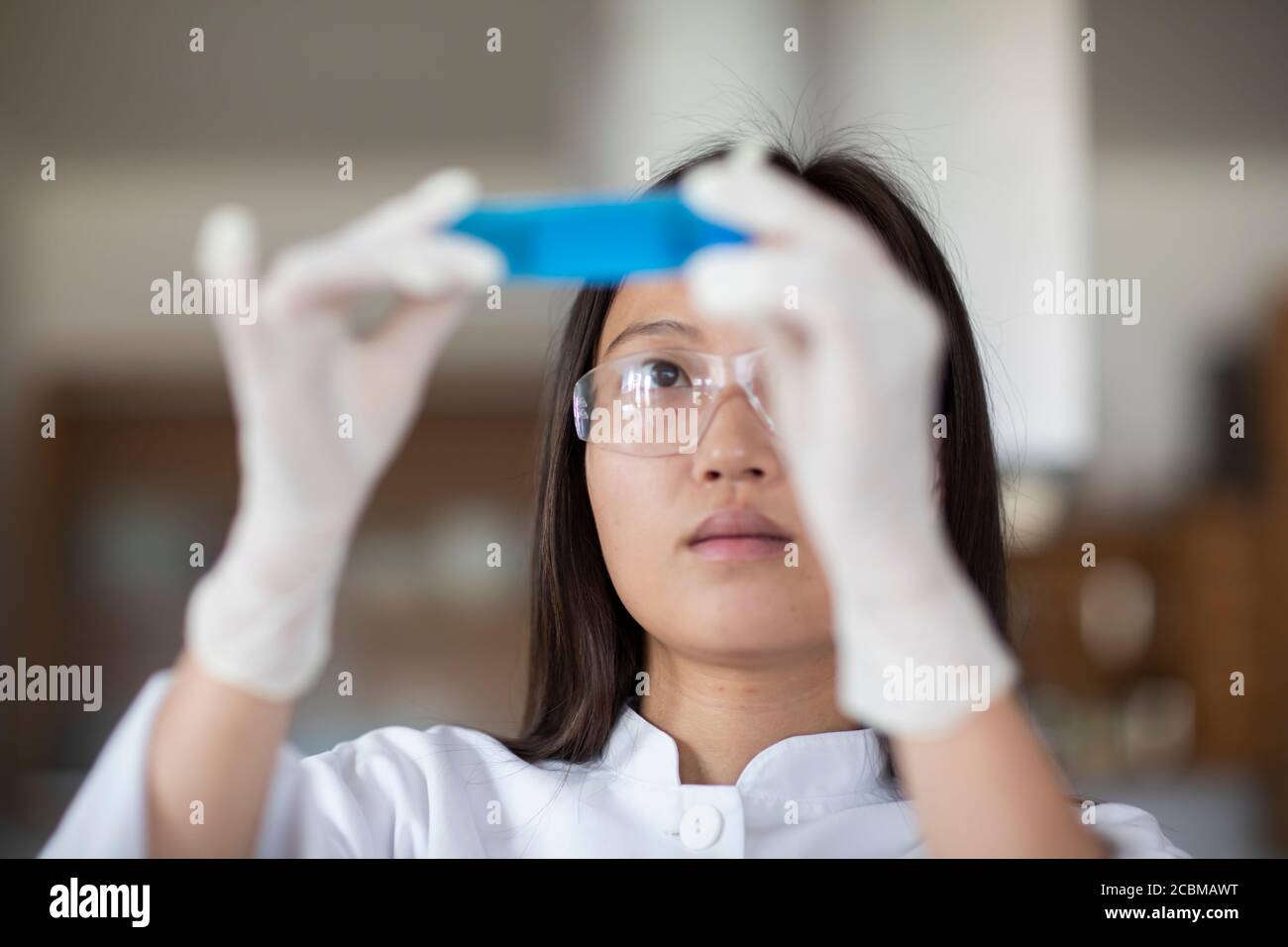 scientist female with lab glasses and tubes in a lab Stock Photo - Alamy