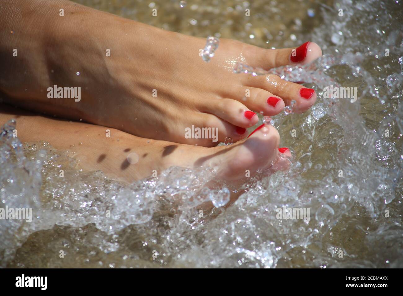 Relaxation in water. Female foot in healing water Stock Photo - Alamy