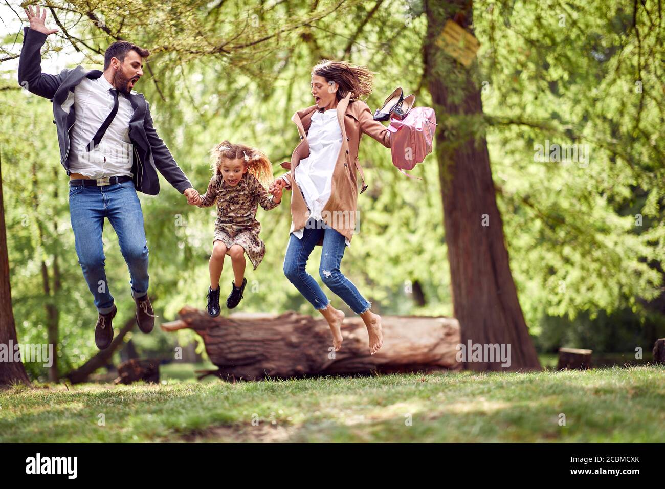 Family playing in a park together after school Stock Photo - Alamy