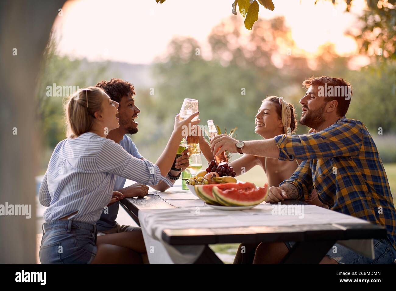 Couple toasting sunset hi-res stock photography and images - Alamy