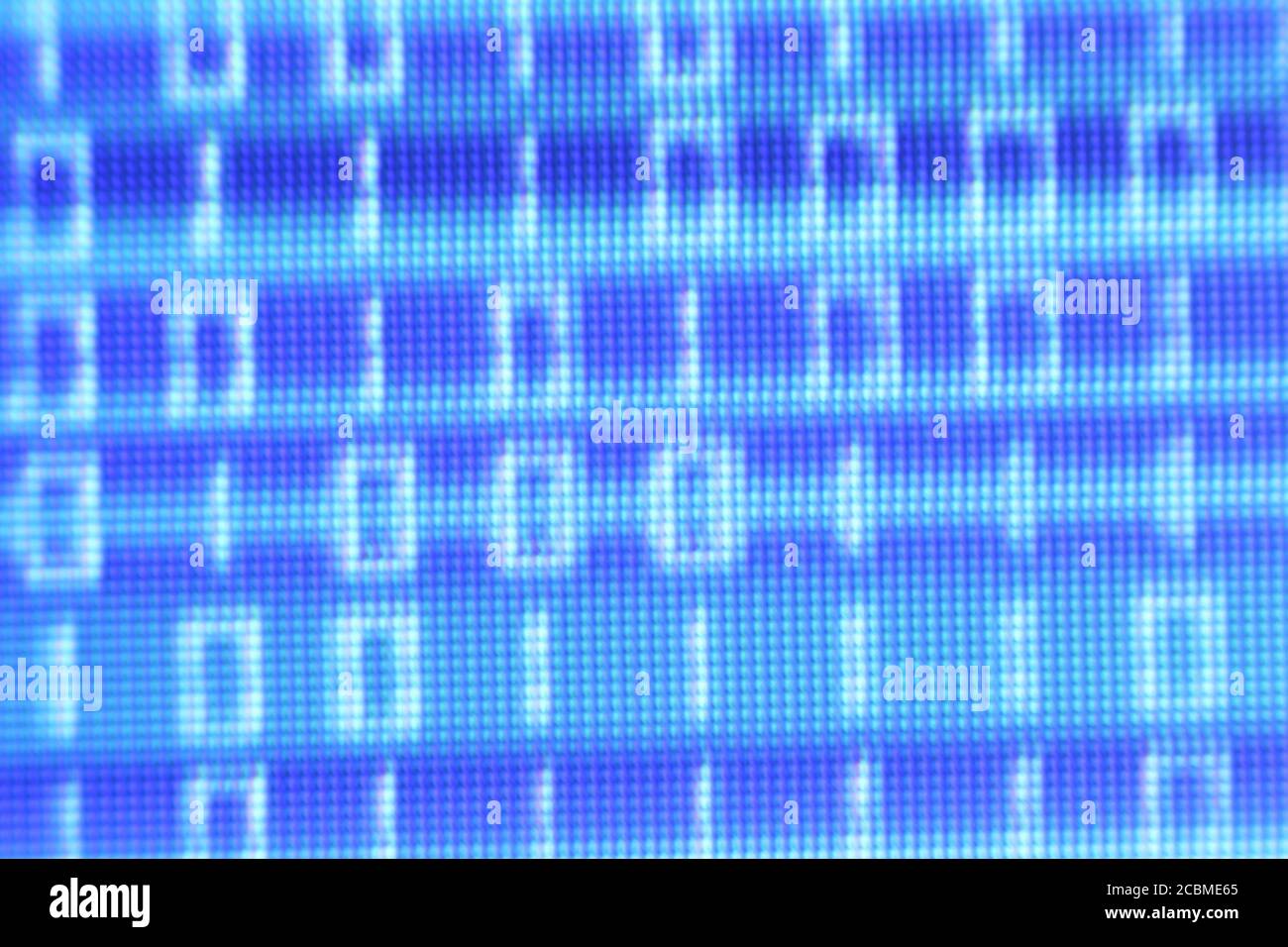 Closeup shot of a blue blurred screen displaying binary codes - a ...