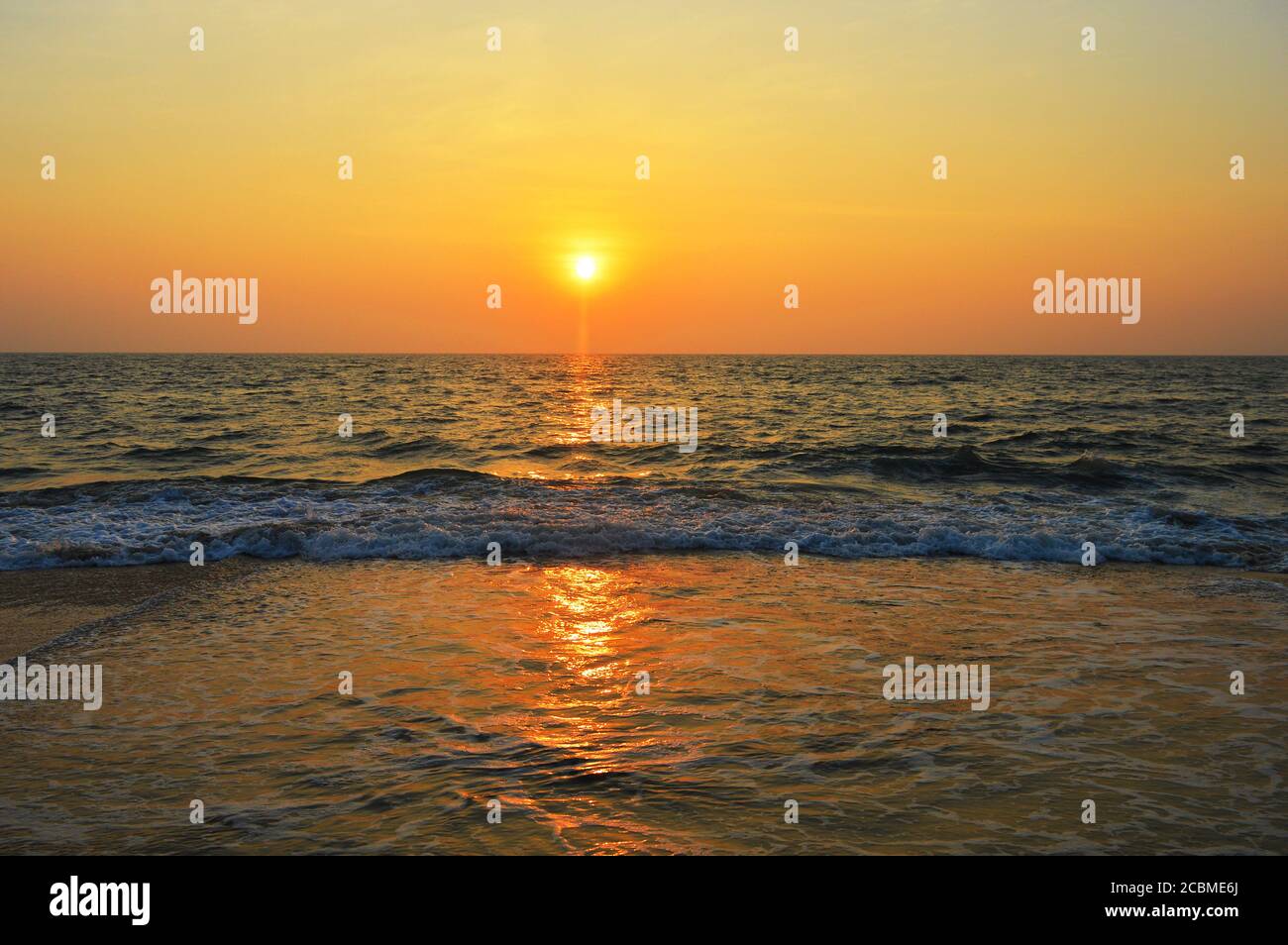 Image shows setting sun at the beach. A sunset represents ending ...