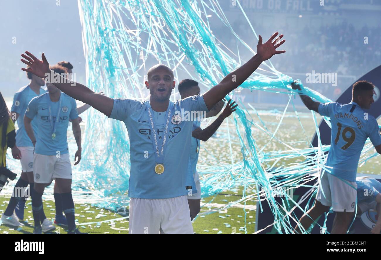 Manchester City captain Vincent Kompany celebrates after lifting ...