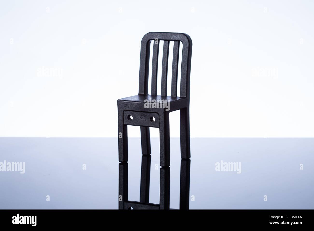 Small metallic chair clothing hanger Stock Photo - Alamy