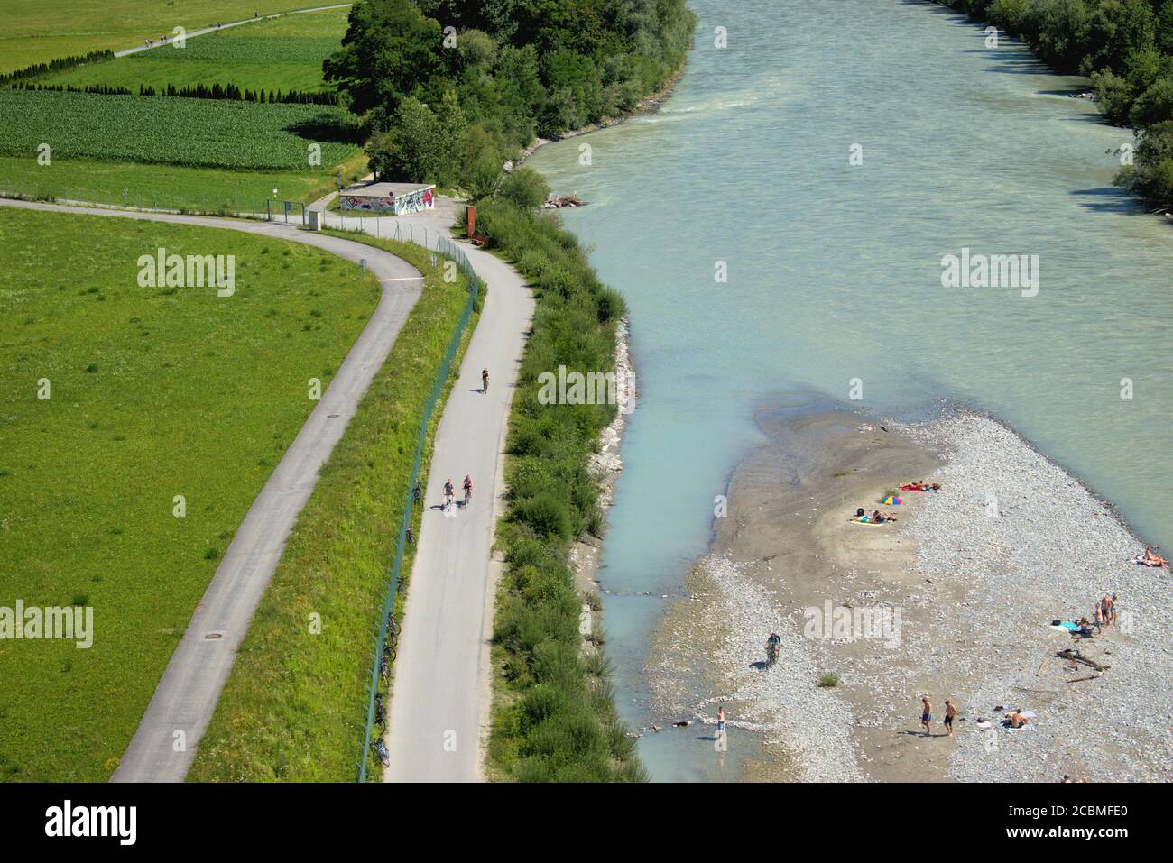 People taking a sunbath at the Inn river in Innsbruck Stock Photo - Alamy