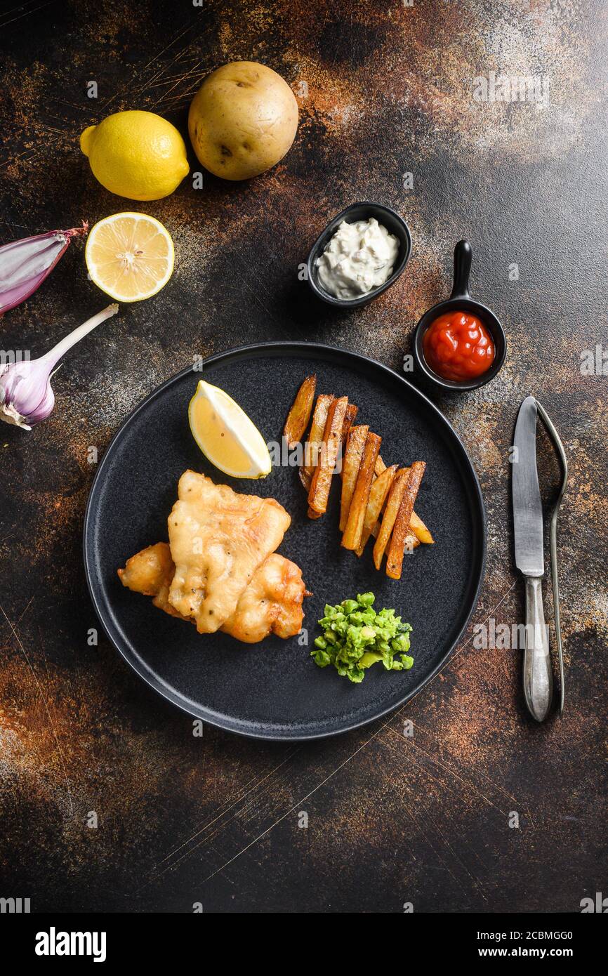 fish and chips with beer-battered cod and fries and a side of tartar ...
