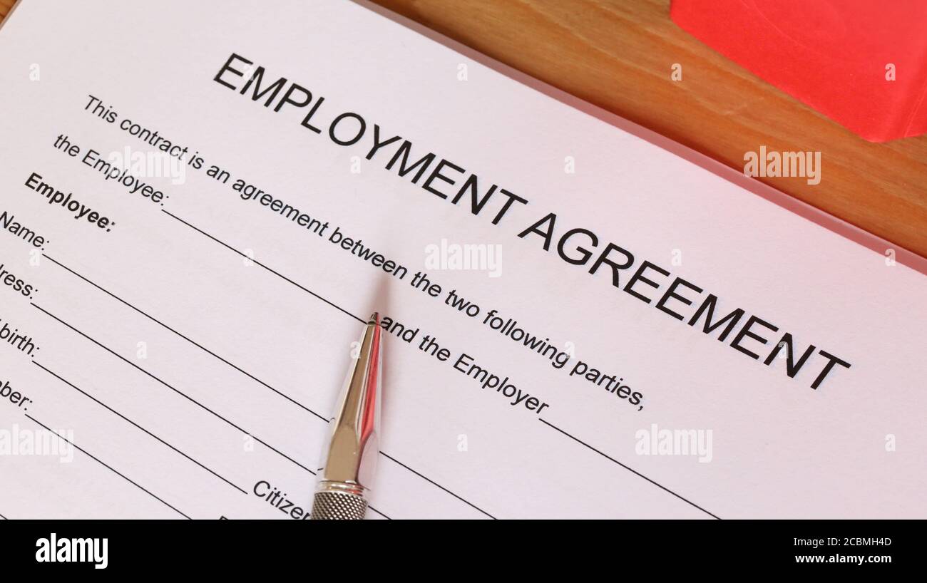Symbol image: Blank form of an employment agreement on a desk Stock ...