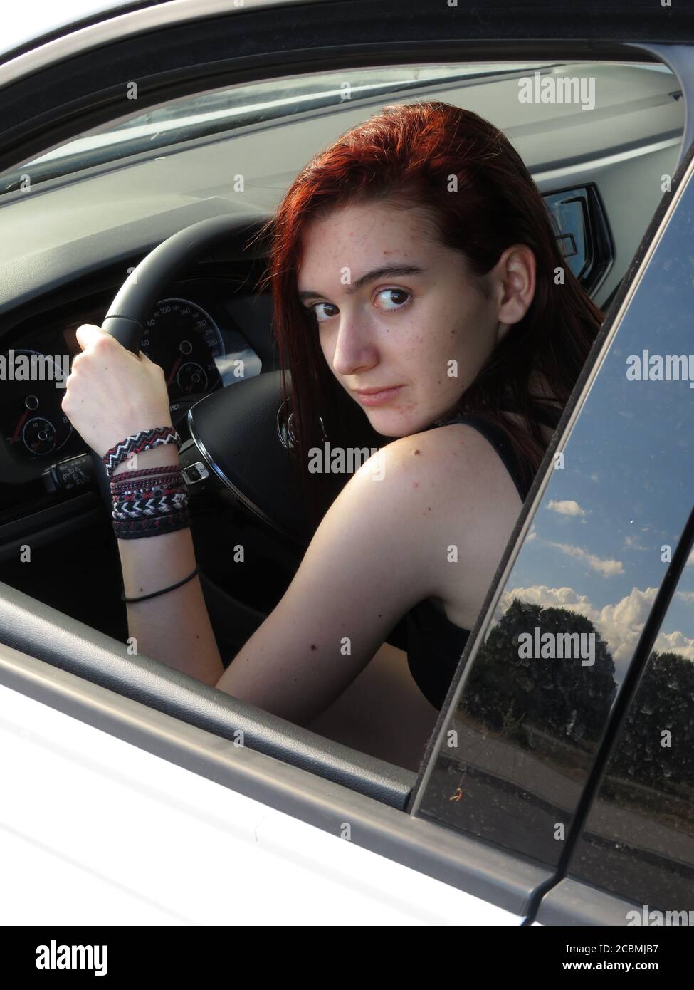 a girl driving Stock Photo - Alamy