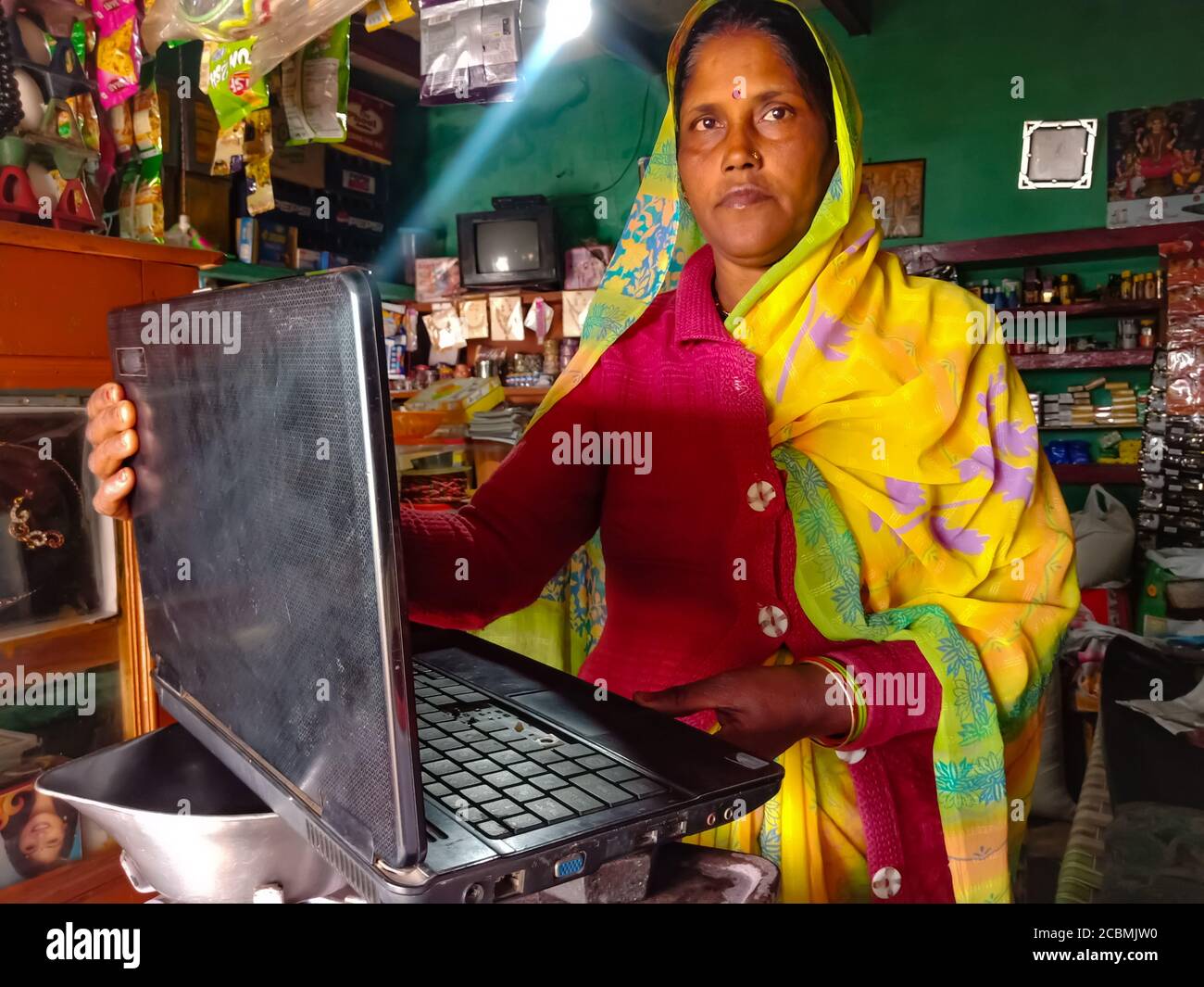 DISTRICT KATNI, INDIA - JANUARY 01, 2020: An indian shopkeeper woman ...