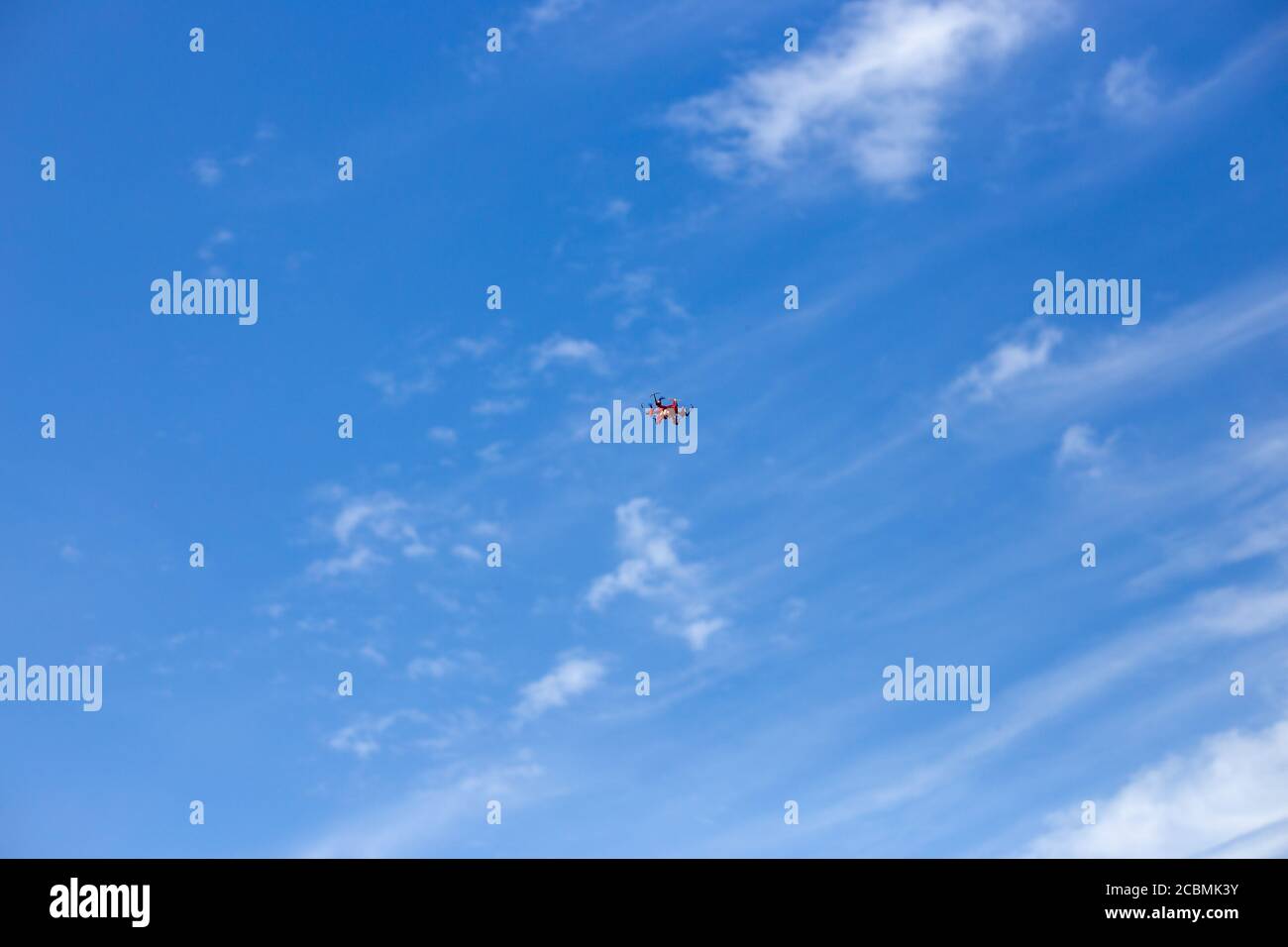 very small toy drone for kids against blue sky, in to the air Stock ...