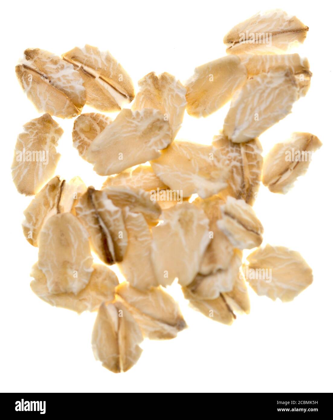 Oat flakes isolated on white background Stock Photo - Alamy