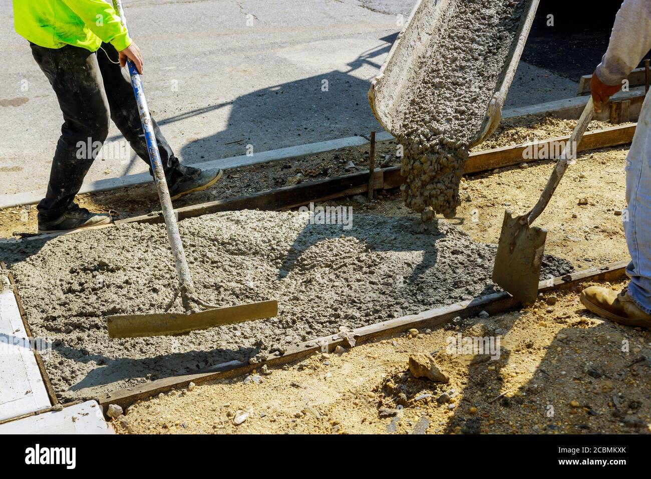 Process of installing construction of new sidewalks laying concrete ...