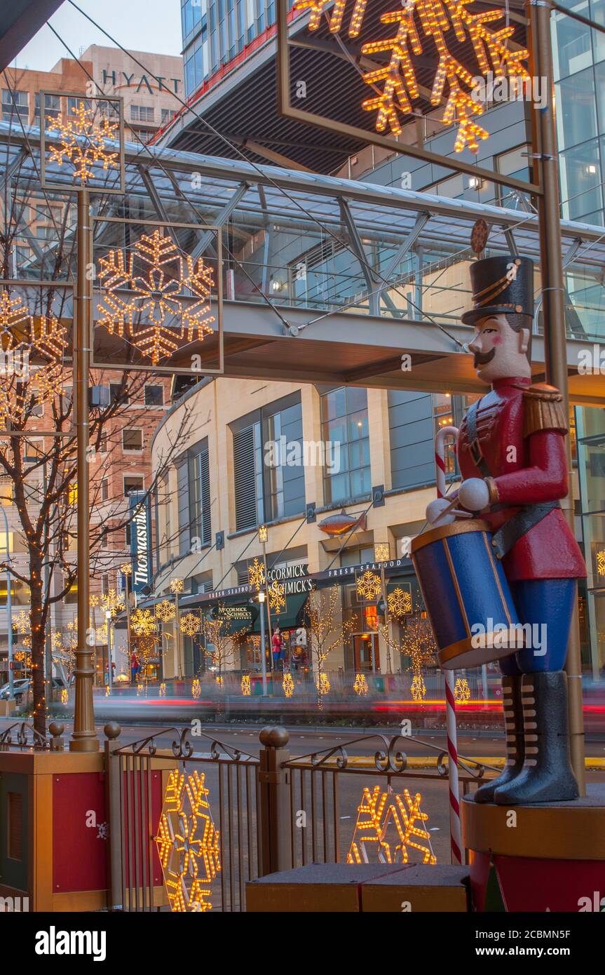 Night photo of the Snowflake Lane holiday decorations with a nutcracker ...
