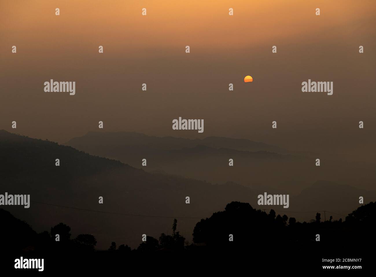 Beautiful Sunset over the hills of Nepal Stock Photo - Alamy