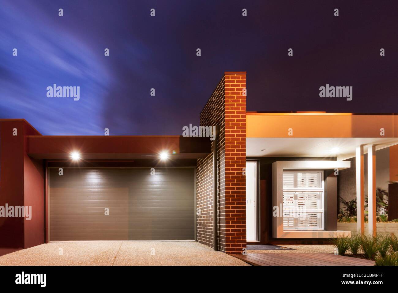 A front view of a modern house with garage Stock Photo - Alamy