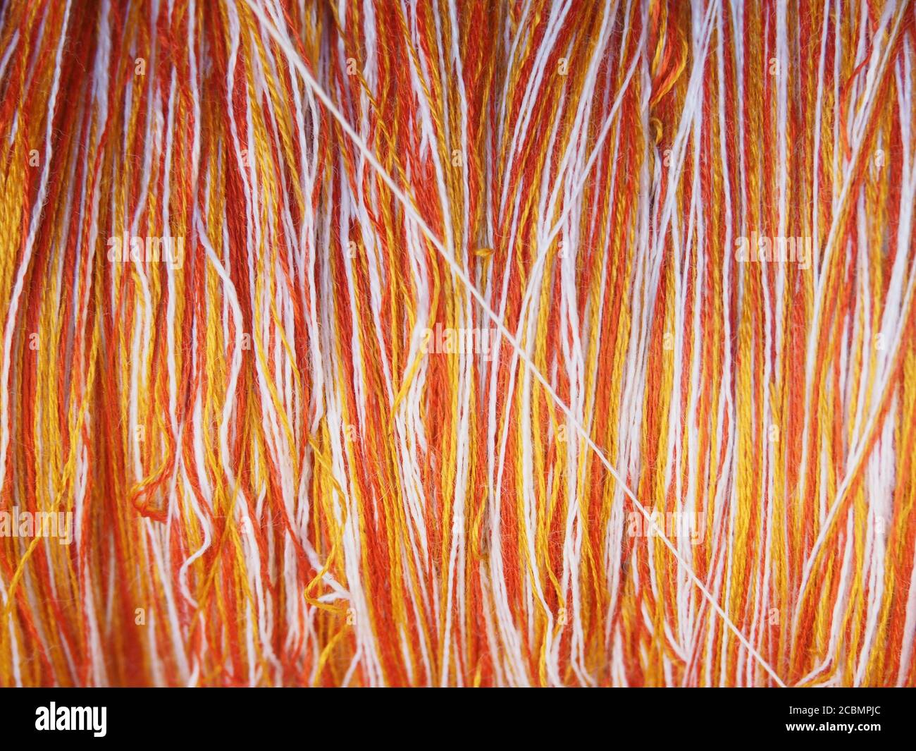 Texture of white, red and yellow threads Stock Photo - Alamy
