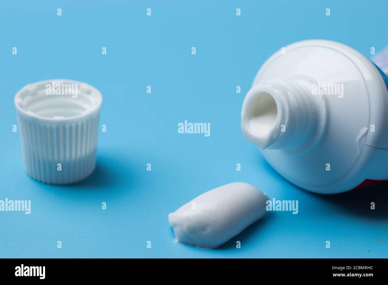 Toothbrush toothpaste blue background hi-res stock photography and ...