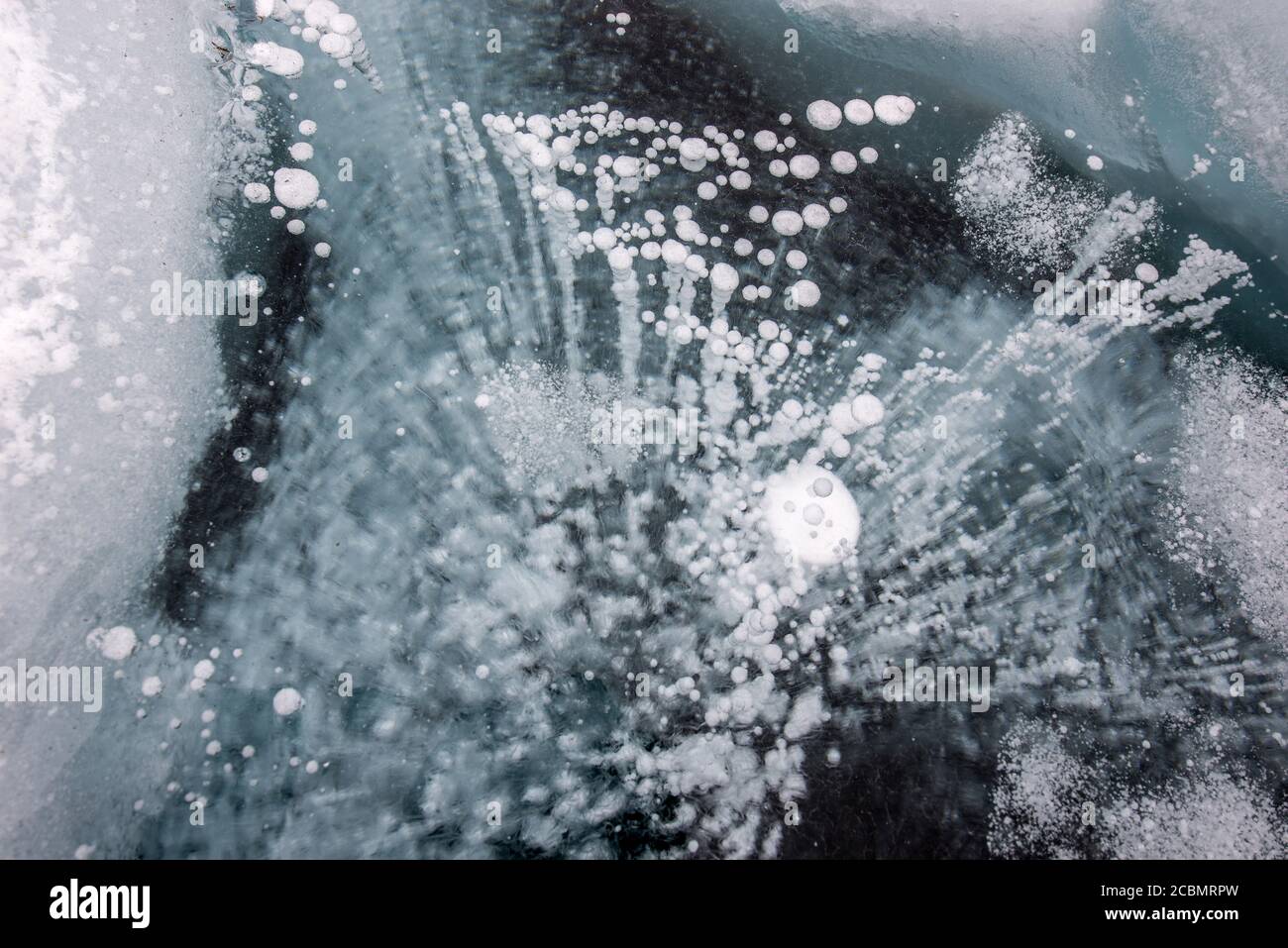 Methane bubbles under the frozen surface of Lake Baikal, Russia Stock ...