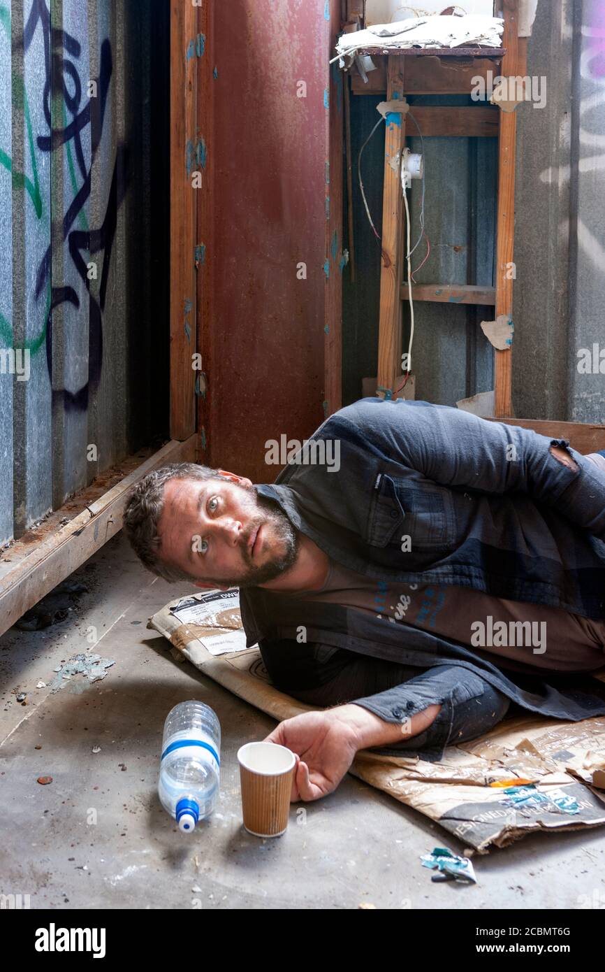 Lonely depressed man on ground hi-res stock photography and images - Alamy