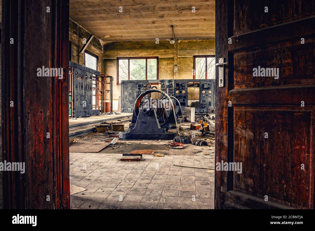 View inside an abandoned factory facility room Stock Photo - Alamy