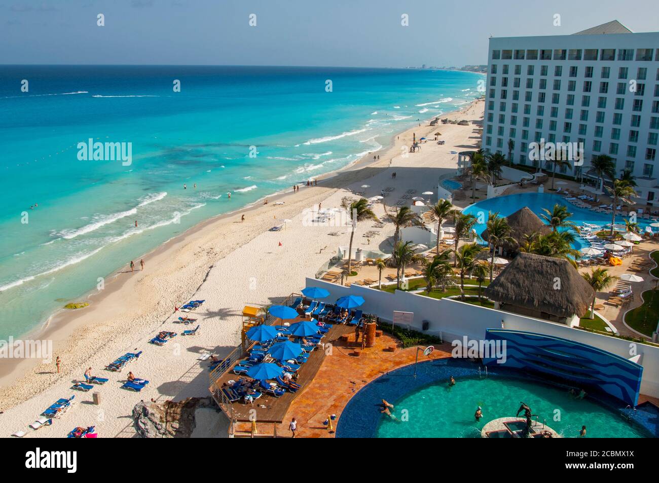 View of the white sand beach with tourists from the Royal Sunset Resort ...