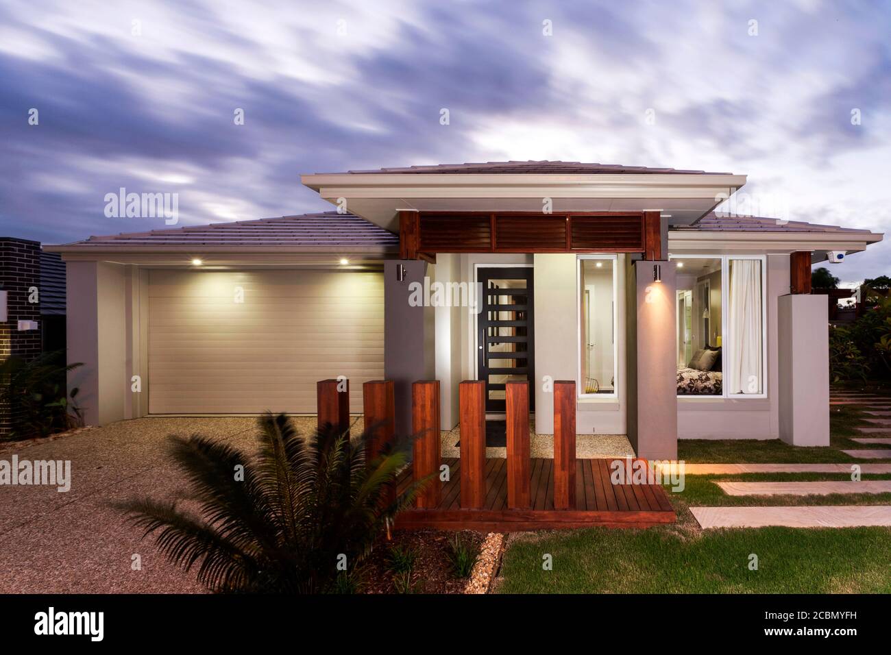 A front view of a modern house with garage Stock Photo - Alamy