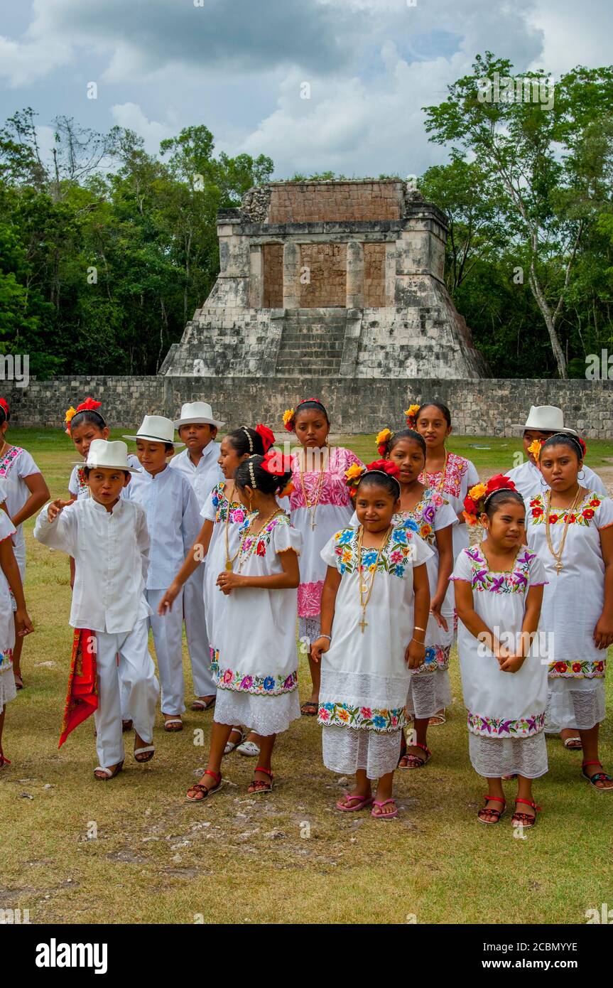 A group of Mayan children (dance group) visiting the great ball court ...