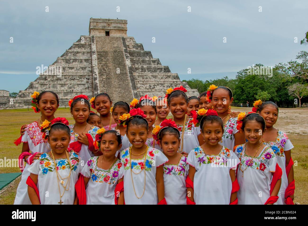 A group of Mayan children (dance group) visiting the Chichen Itza ...
