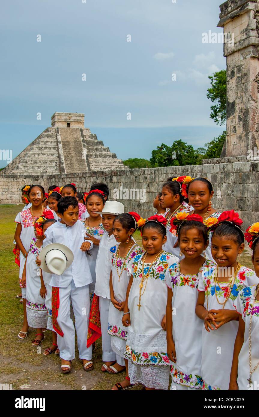 A group of Mayan children (dance group) visiting the Chichen Itza ...