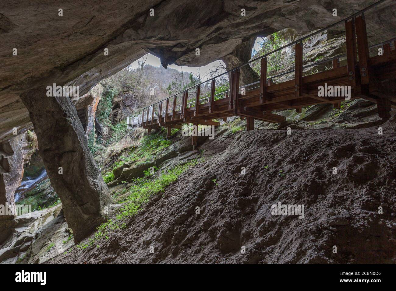 Ancient caves carved into the mountain wall hi-res stock photography ...