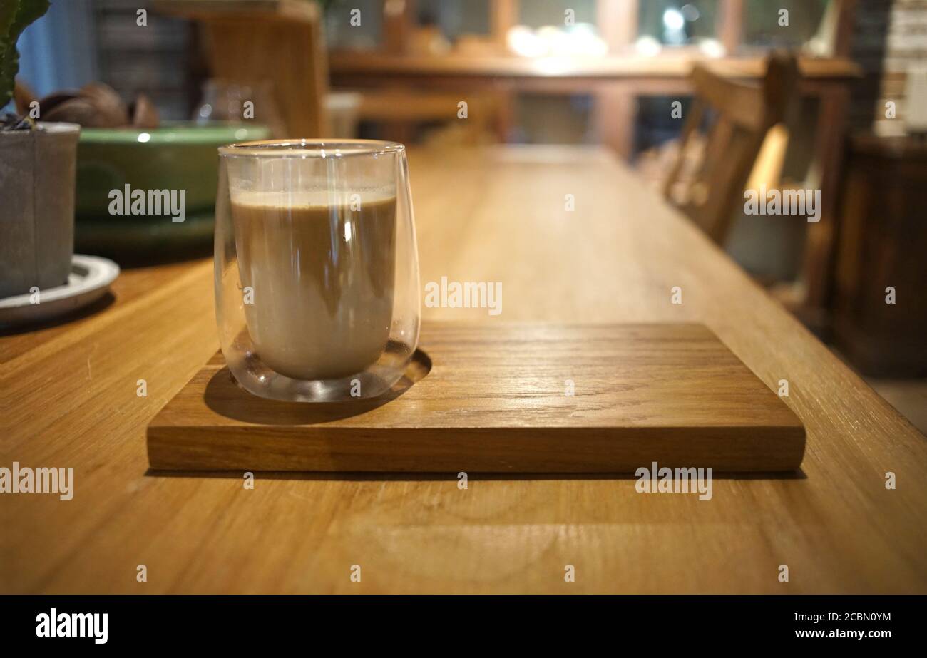 Iced Latte coffee in a grass Stock Photo - Alamy