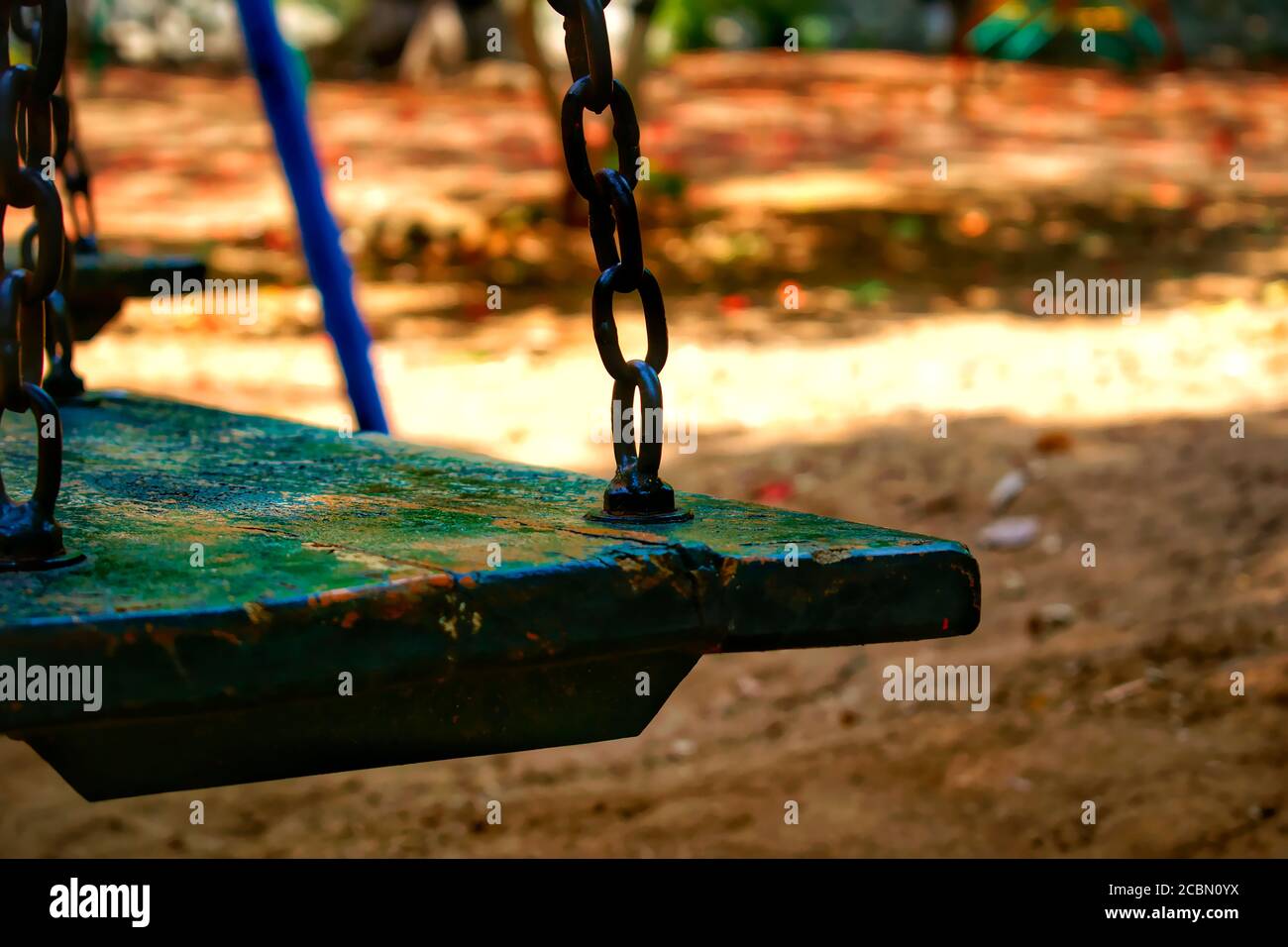 Blue and yellow swing set hi-res stock photography and images - Alamy