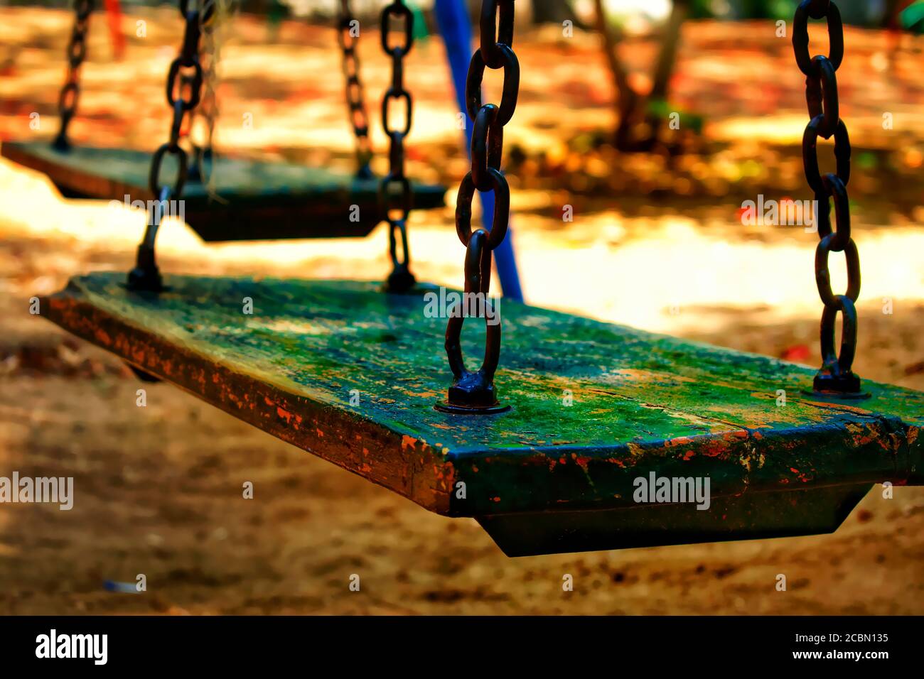 Blue and yellow swing set hi-res stock photography and images - Alamy