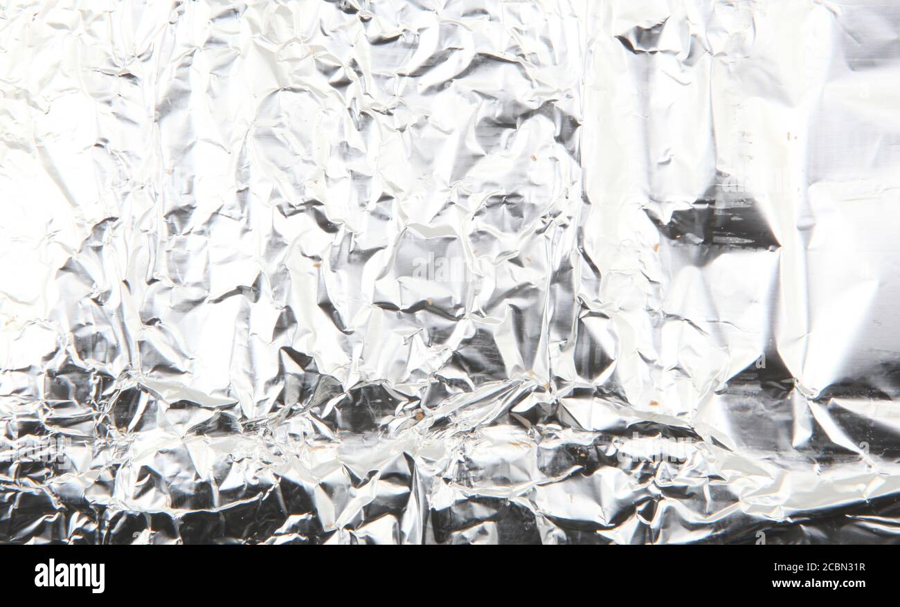 Scrunched shiny aluminium foil surface Stock Photo - Alamy